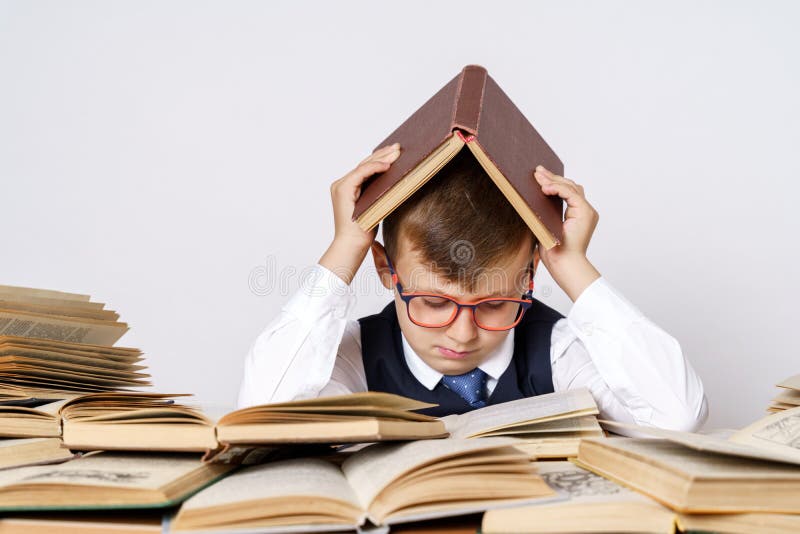 The Student Does His Homework, Reads, Put the Book on His Head. There ...