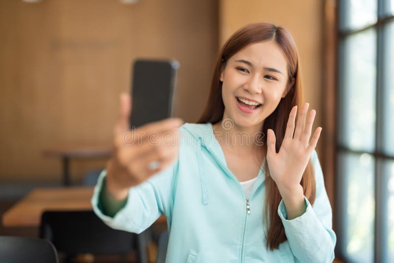 Education Concept, Teenage Girl Using Smartphone To Video Call with ...