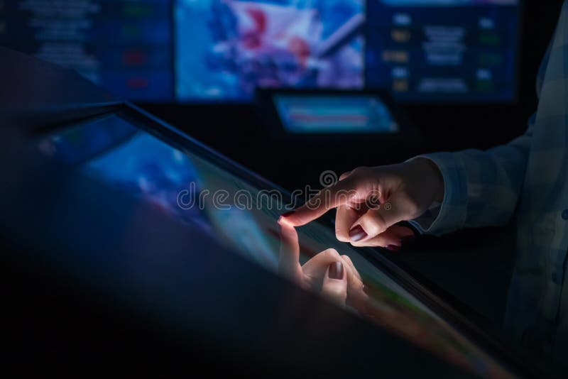 Woman Using Interactive Touchscreen Display at Modern Museum or ...