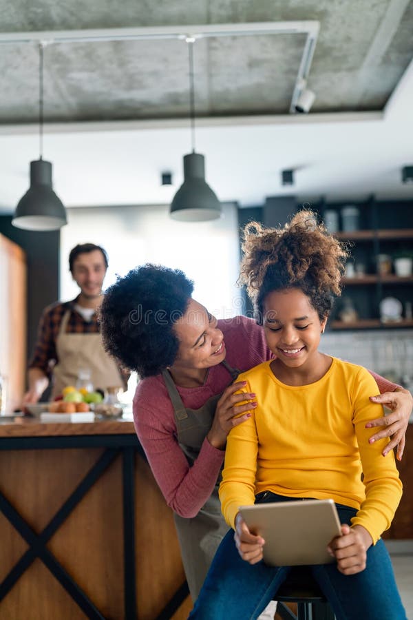 Education, Family and Learning Concept. Mother and Daughter with Tablet ...