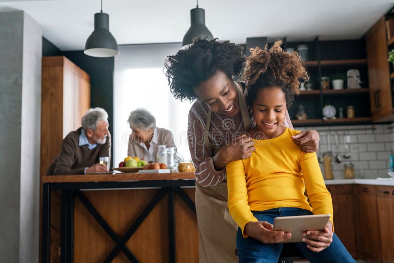 Education, Family and Learning Concept. Mother and Daughter with Tablet ...