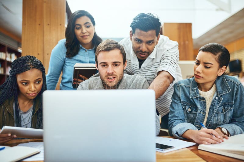 Education, Friends and Laptop in University Library for Research ...