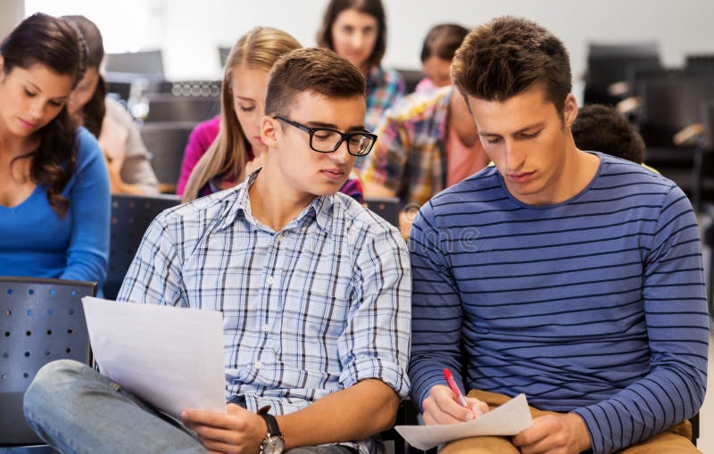 Group of Students with Papers in Lecture Hall Stock Photo - Image of ...