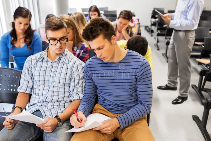 Group of Students with Papers in Lecture Hall Stock Photo - Image of ...