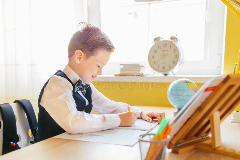 Education at Home Concept - Cute Little Boy Studying or Completing Home ...