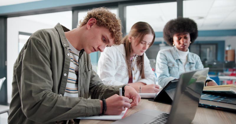 Education, Laptop and Study Group with Students in Library of ...