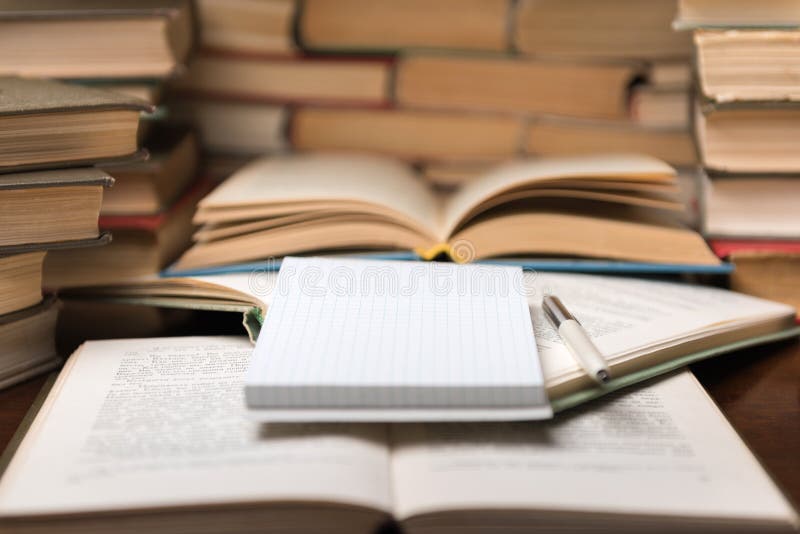 Education Learning Concept with Open Book and Notebook on the Table ...