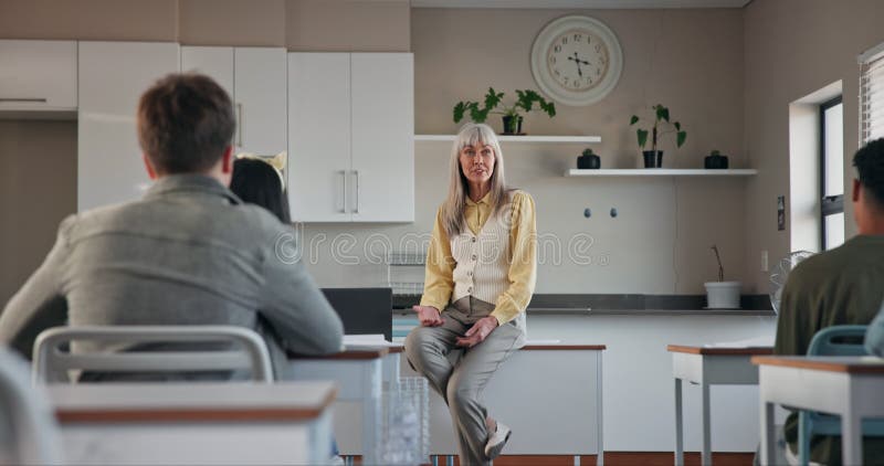Education, Lesson and Teacher Talking To Students in Classroom of ...