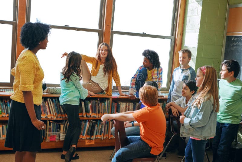 Education Library, Teacher and Children Students in Classroom of ...