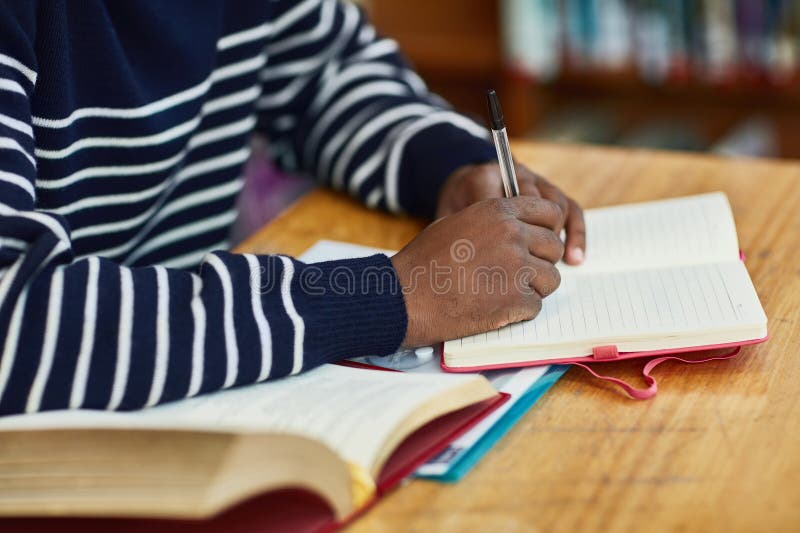 Education, Notebook and Writing with Hand of Student in Library of ...