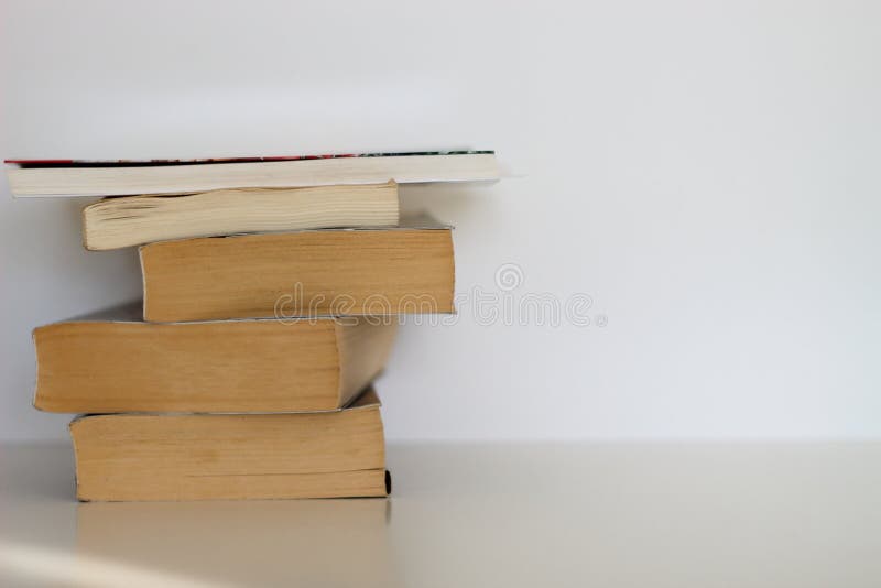 Education and Reading Concept. Group of Books on the White Table Stock ...