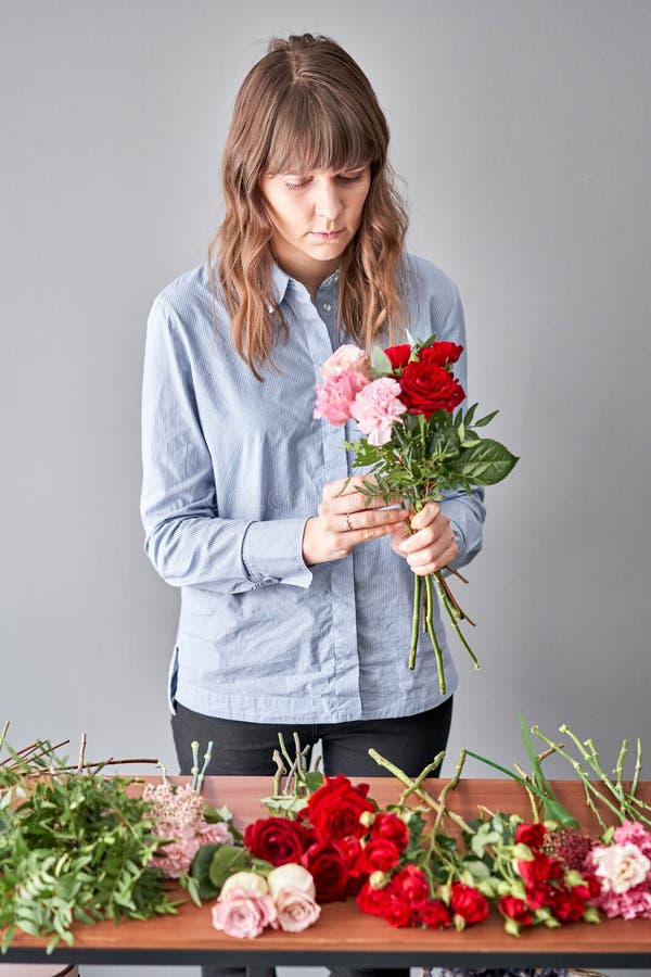 Woman Florist Creating Beautiful Bouquet in Flower Shop. Work in Flower ...