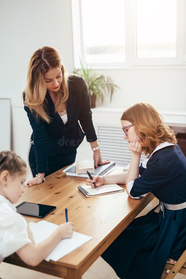 Female Teacher Pupils School Lesson in Classroom. Stock Image - Image ... Female Teacher Pupils School Lesson in Classroom. Stock Image - Image ...