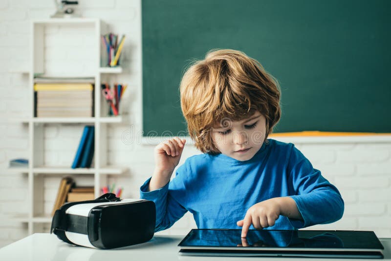 Education. School for Talented Pupil. Schoolboy with Digital Tablet in ...
