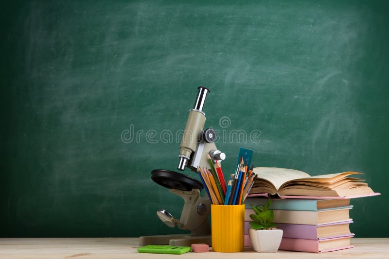 Science Concept Microscope on the Table in the Auditorium, Blackboard ...