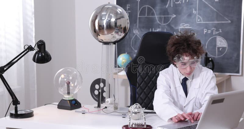 Education, Science and Kids Concept - Boy Wearing Goggles for Physics ...