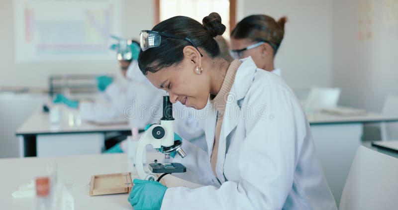 Education, Science and Students in Laboratory with Microscope for ...