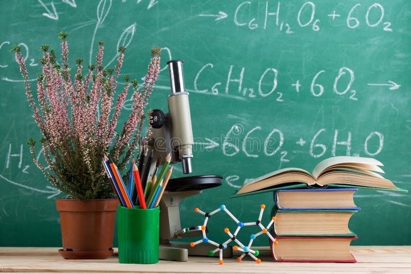 Education and Sciences Concept - Books on the Teacher Desk in the ...