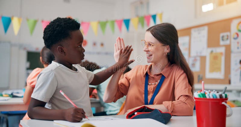 Education, Teacher and High Five Boy in Classroom for Lesson Support ...