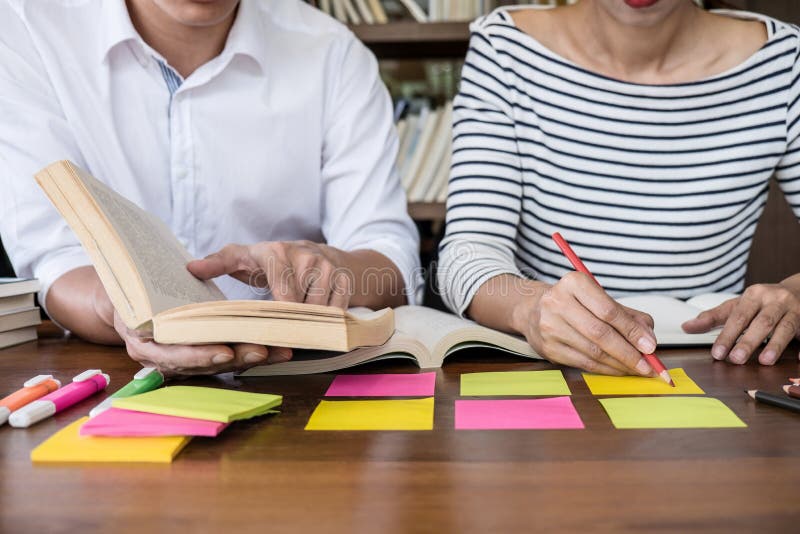 Education, Teaching, Learning Concept. Two High School Students or ...