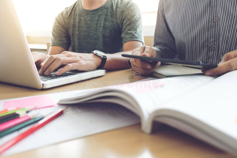 Education, Teaching, Learning, Technology and People Concept. Two High ...