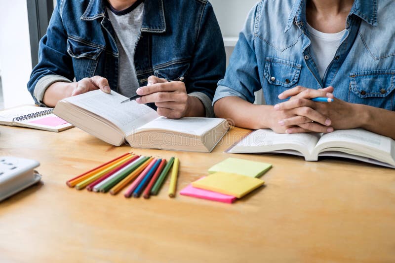 Education, Teaching, Learning, Technology and People Concept. Two High School Students or ...