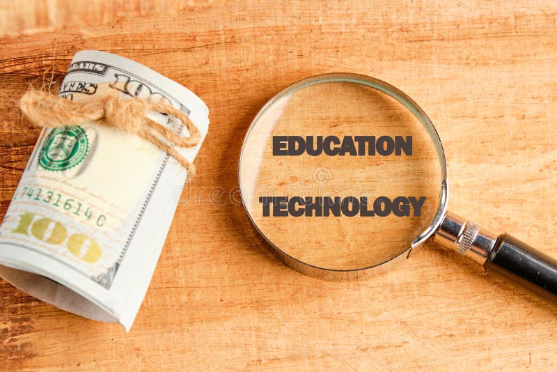 Education Technology Concept Words through a Magnifying Glass on Papyrus Next To Dollar Bills ...
