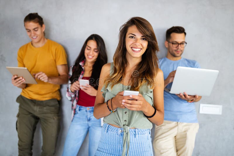 Education, Technology and People Concept. Happy Group of Friends Using ...