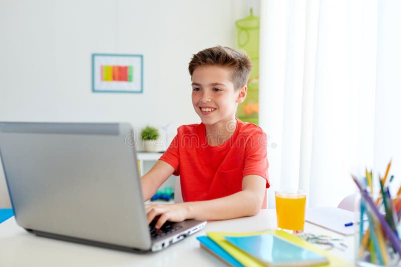 Student Boy Typing on Laptop Computer at Home Stock Image - Image of ...