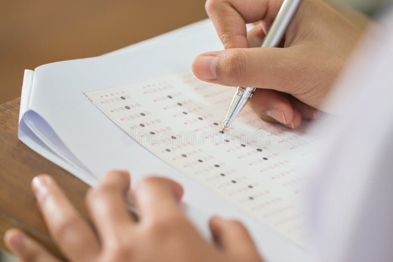 Education Test Concept : Blur of Hand Student Holding Pen for Testing ...
