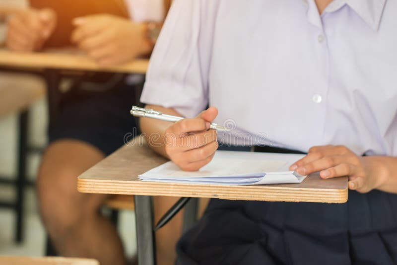 Education Test Concept : Hands Asian Students Thai Uniform Holding Pen ...
