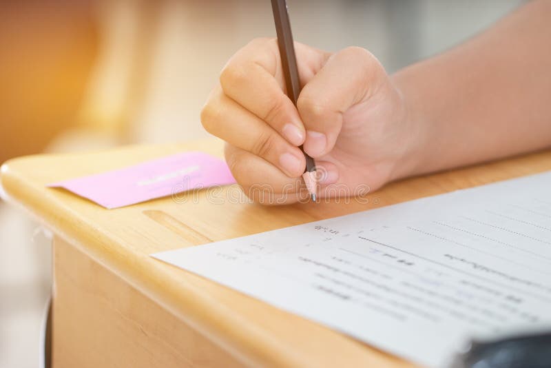 Education Test Concept : Hands Student Holding Pen for Testing Exams ...