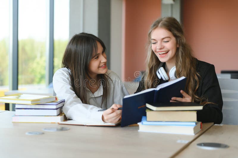 Education. Two Clever Modern Students in Black and White Uniform Study ...