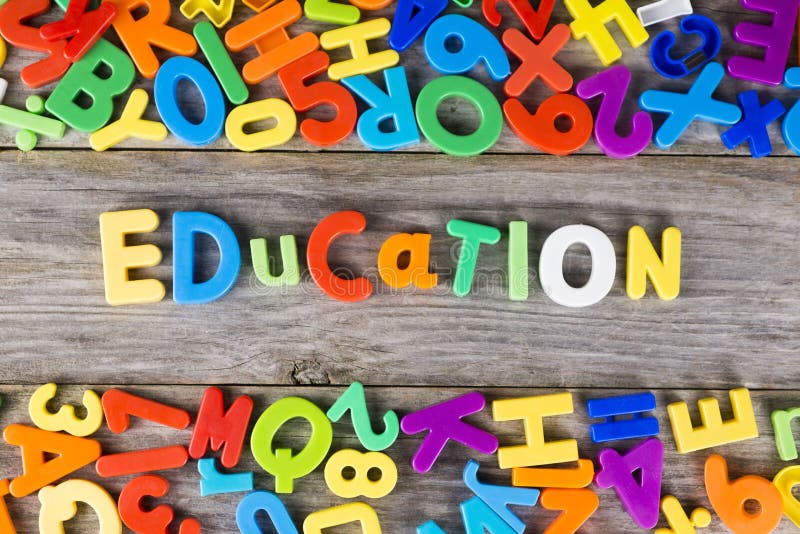 Education Word From Plastic Colored Letters On Wooden Background Stock