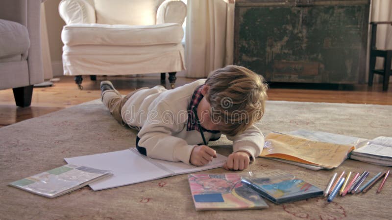 Education, Writing and Homework with Child on Carpet of Living Room for ...