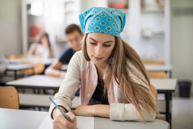 Teenagers Students Sitting in the Classroom Working Exam Stock Image ...