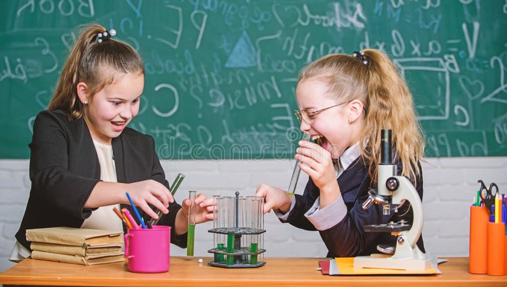 Educational Experiment Concept. Microscope and Test Tubes on Table. Be ...