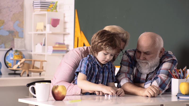 Educational Games. Father and Son with Grandfather Having Fun ...