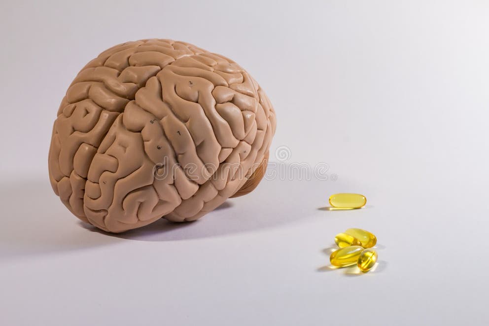 Educational Model of the Human Brain with Pills, in the Background ...