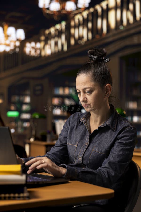 Educator Preparing Documents and Learning Materials for Her Teaching ...