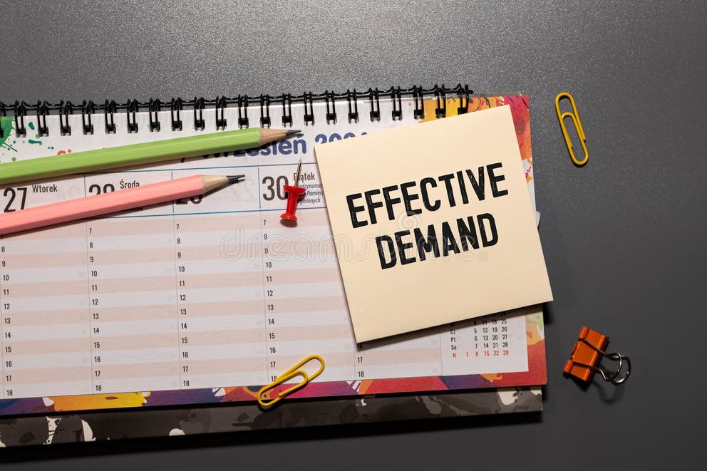 EFFECTIVE DEMAND Text on Notebook with Chart and Calculator and Coins ...