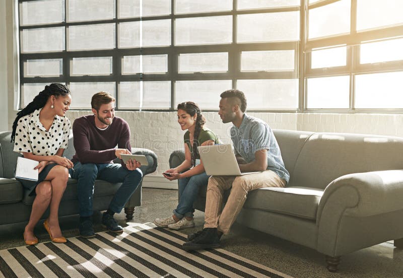 Teamwork Gets Business Done. a Group of Businesspeople Going Over Some ...