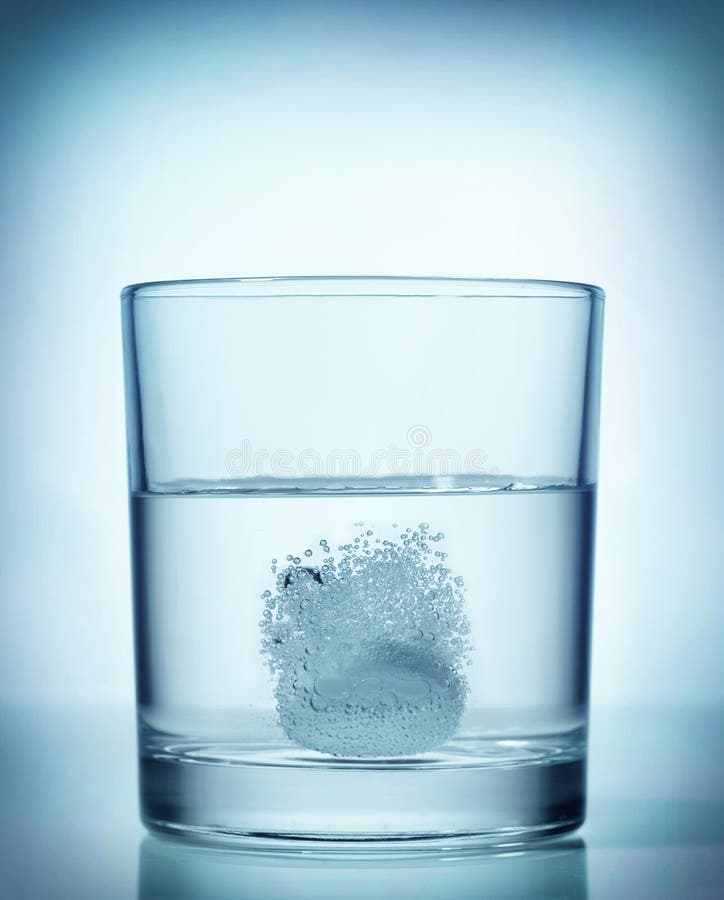 Effervescent Dissolving Fizzy Tablet in Water Stock Photo - Image of ...