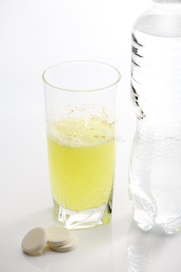 The Effervescent Tablet Dissolves in a Glass of Water Stock Photo ...