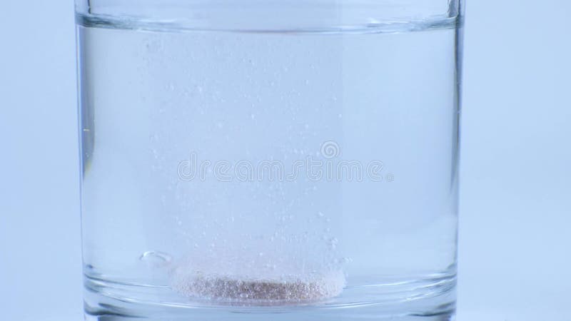 Bubbling Reaction in Clear Glass with Effervescent Tablet. Slow Motion ...