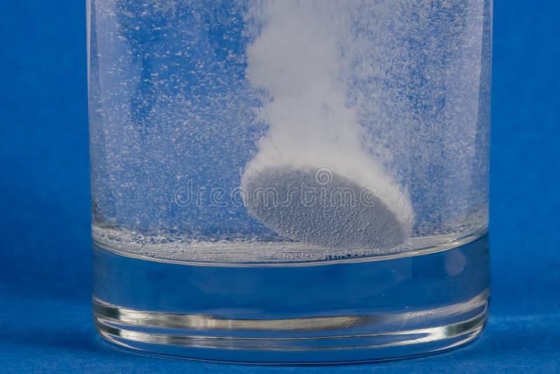 Tablet Dissolving in a Glass O Stock Photo - Image of water, blue: 2678882