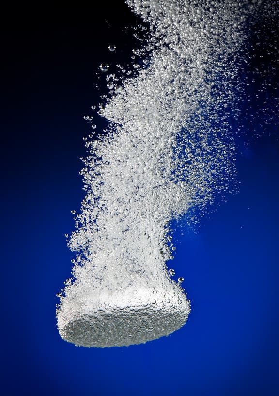 Effervescent Tablet in Water with Bubbles Stock Image - Image of ...