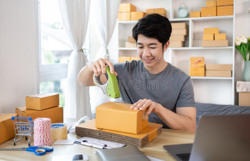 Efficient Home-Based Delivery, Man Packing Items into Post Box for ...