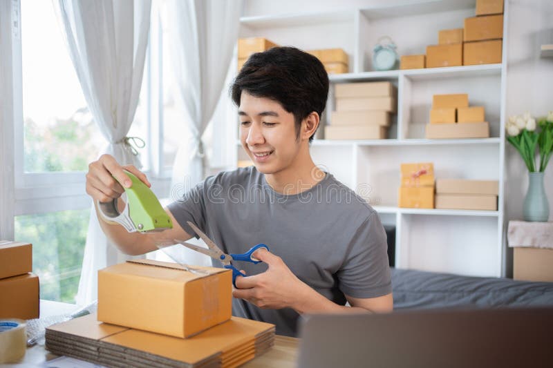 Efficient Home-Based Delivery, Man Packing Items into Post Box for ...