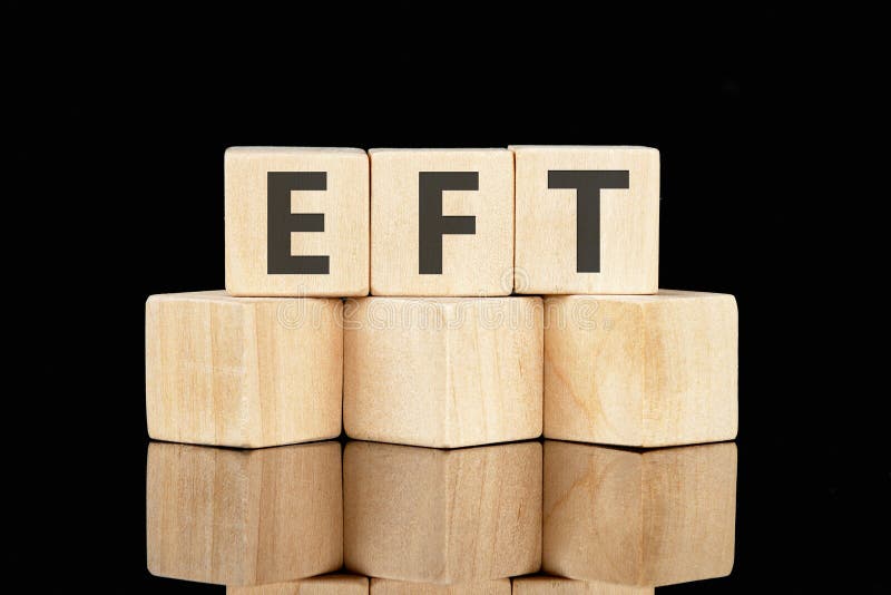 EFT Text Assembled from Wooden Cubes on a Black Background Stock Photo ...